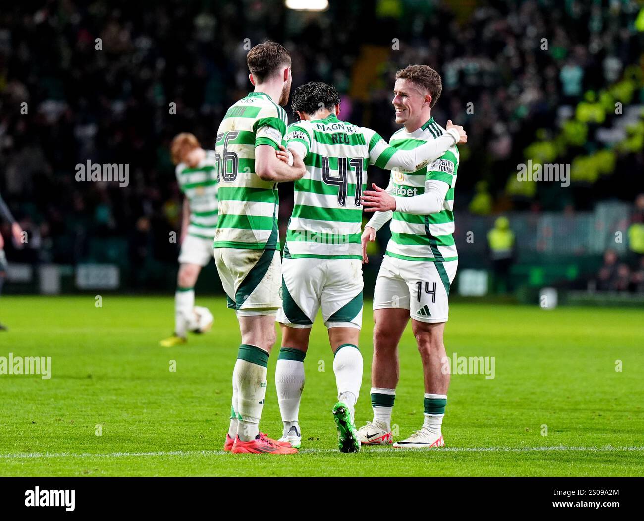 Celtic's Reo Hatate (centre) celebrates scoring their side's fourth ...