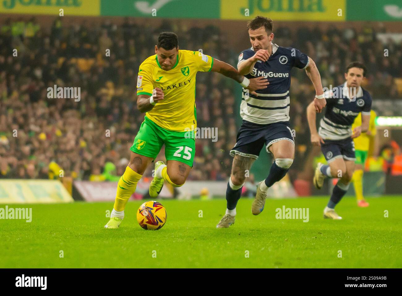 Onel Hernández of Norwich City is pressured by Joe Bryan of Millwall ...