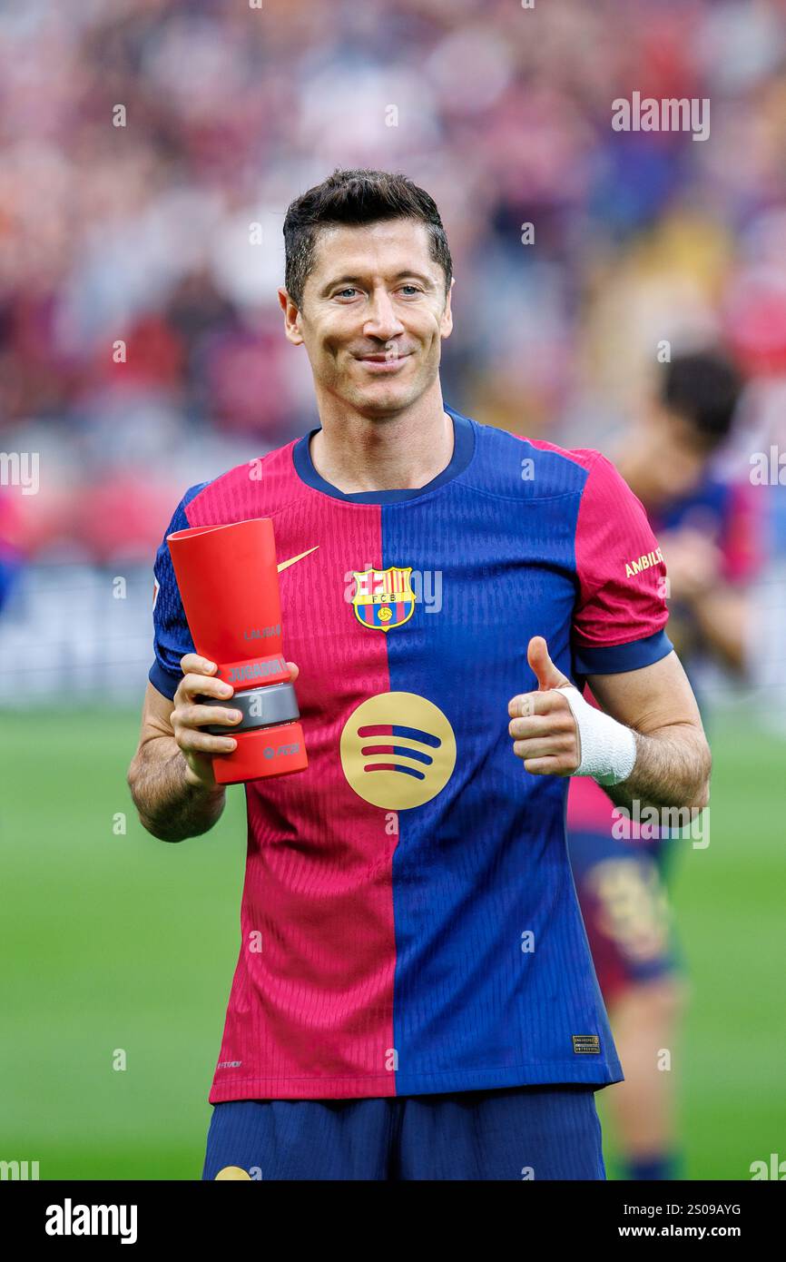 Barcelona, Spain. 3rd November, 2024. Lewandowski lifts the Player of ...