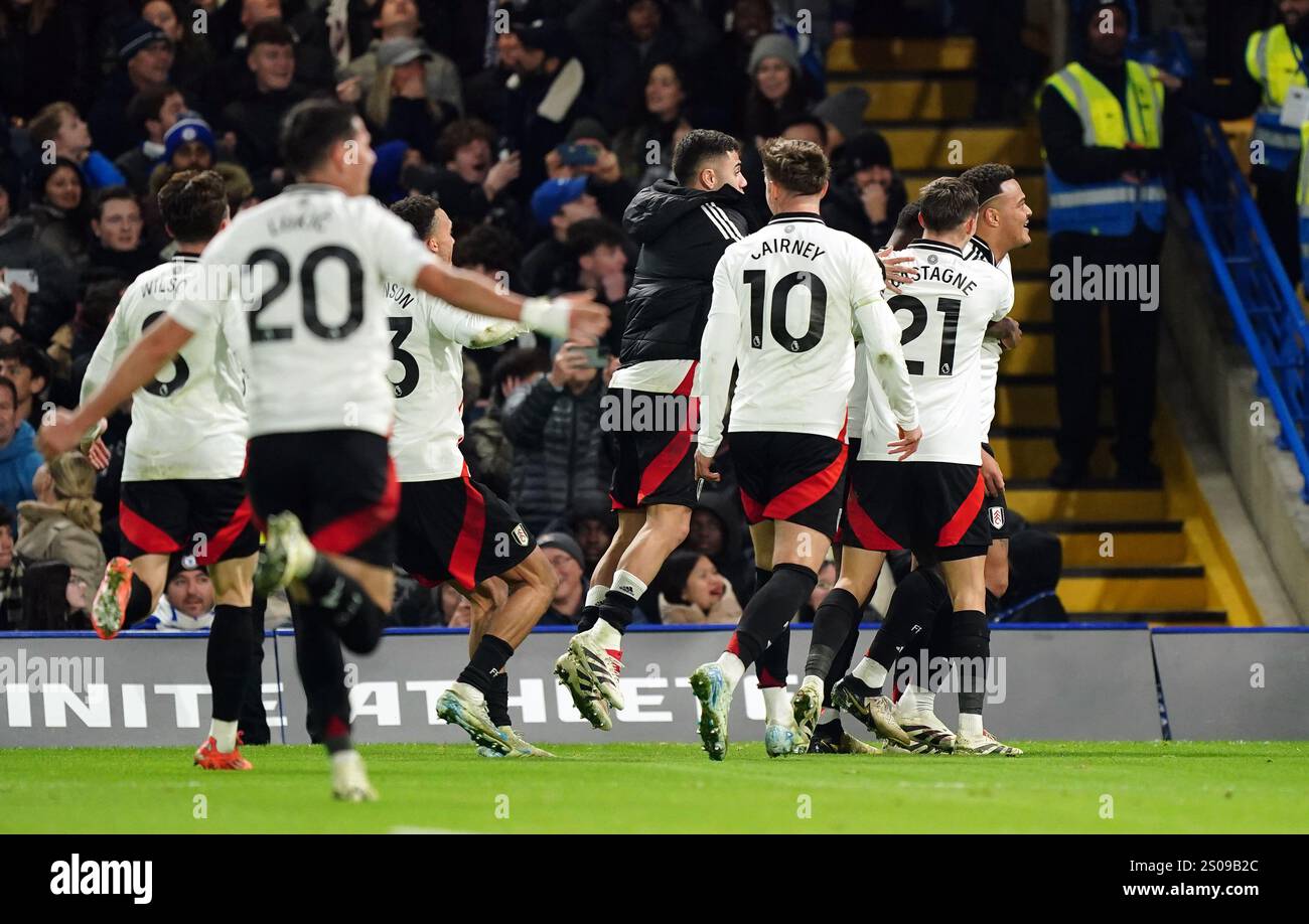 Fulham players celebrate with their fans after Rodrigo Muniz scored his ...