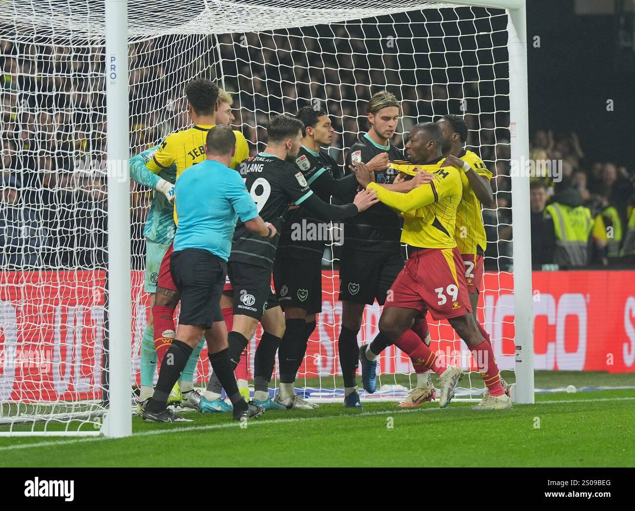A brawl erupts between the players after Watford's Kwadwo Baah scores a ...