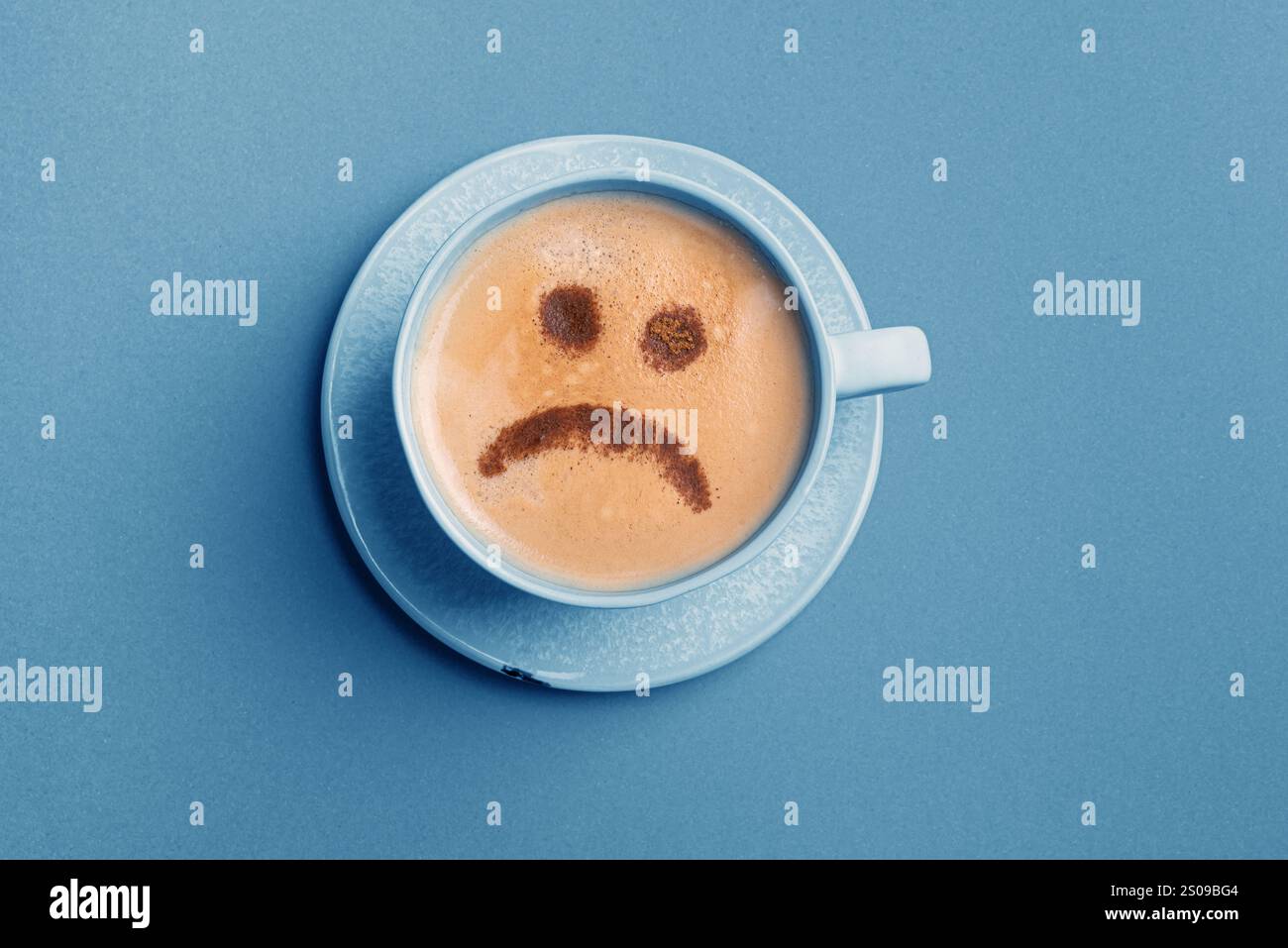 Upset face on coffee foam. Blue Monday. Seasonal depression or disorder ...