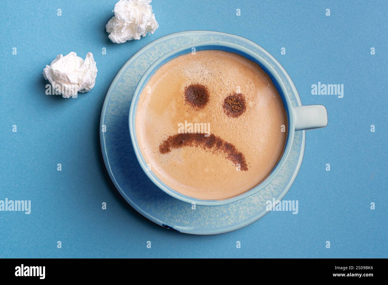 Blue Monday and depression concept. Cup of cappuccino coffee with ...