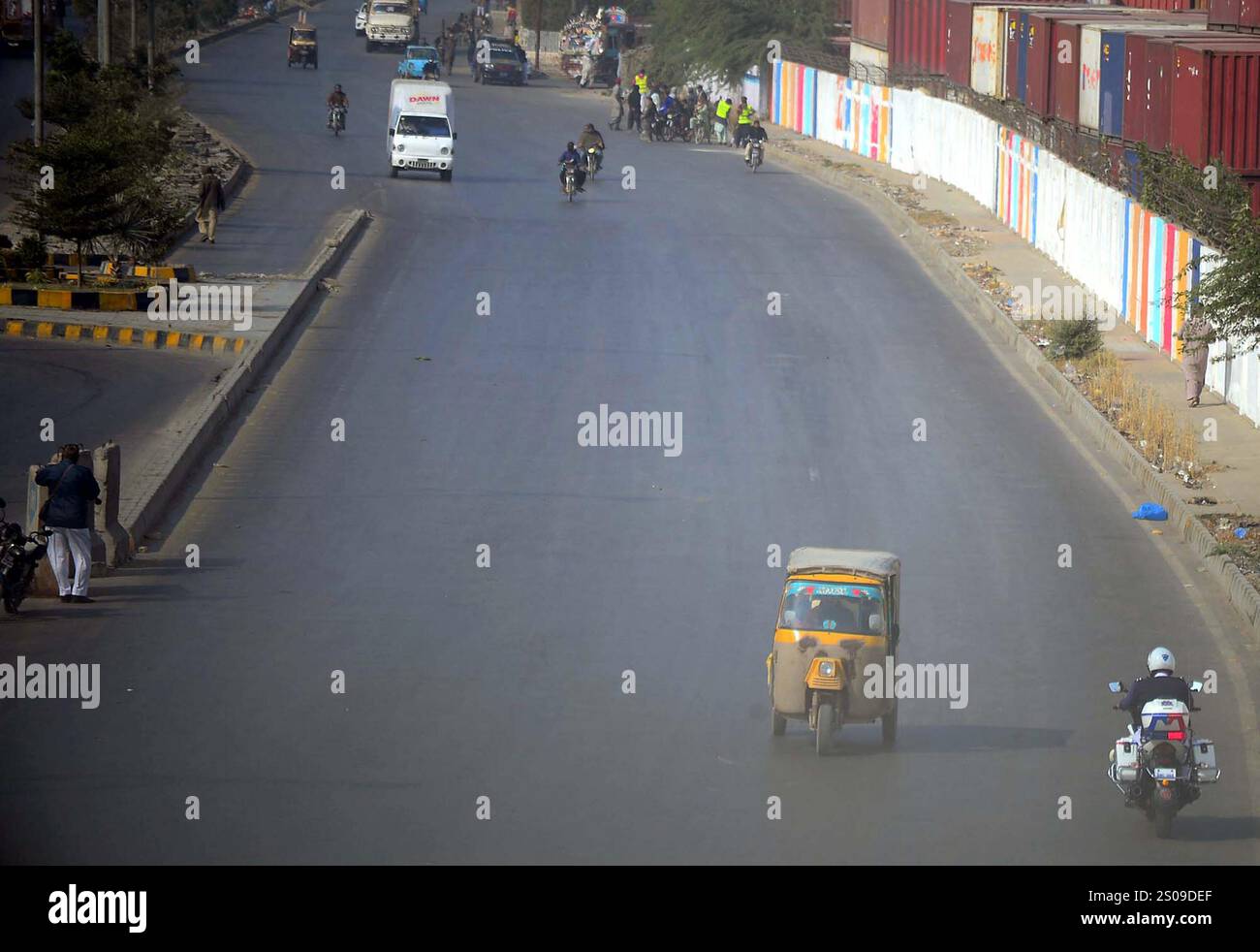Traffic Police motorcyclist passes through wrong side of road violates ...