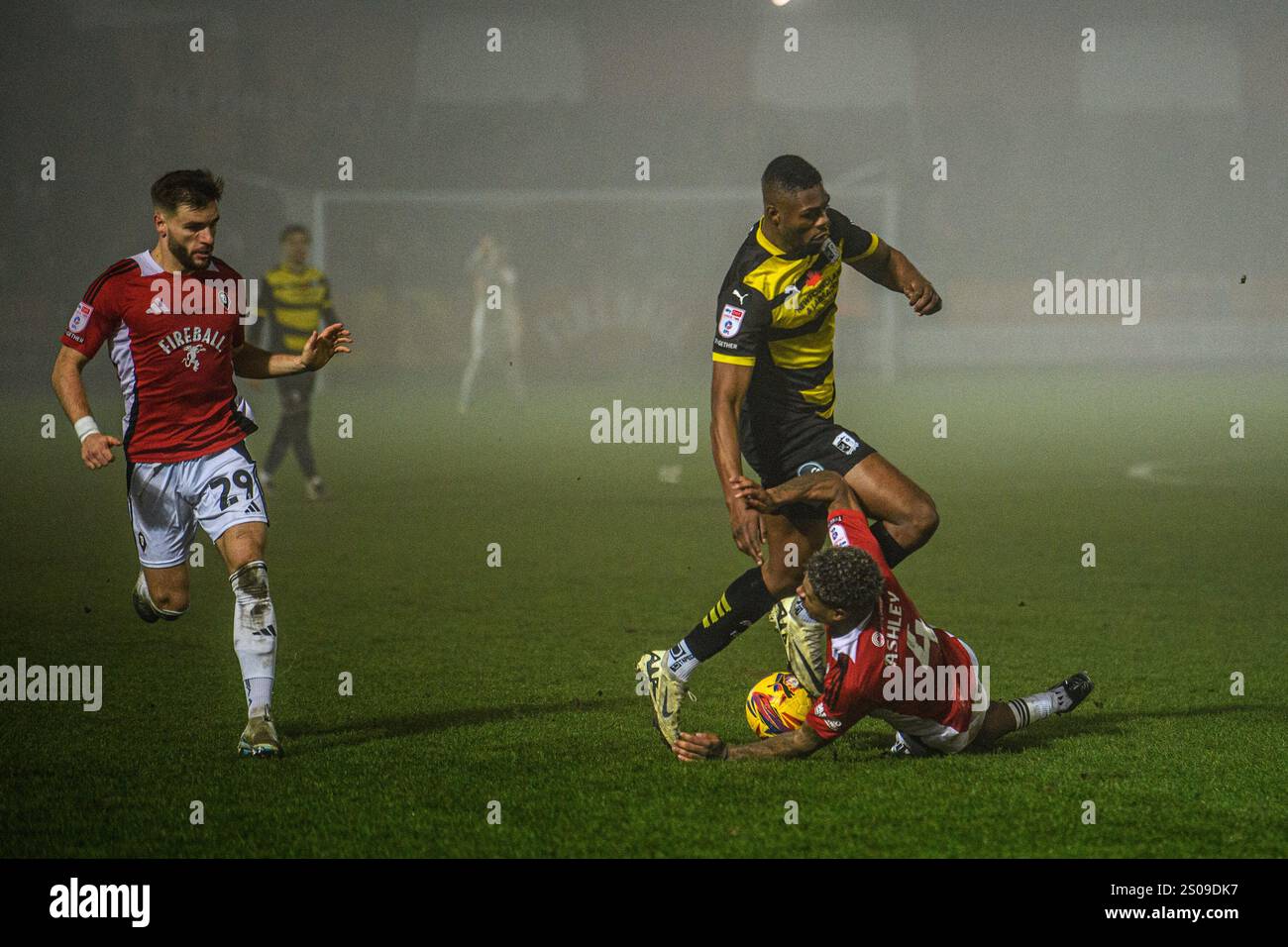 Ossama Ashley of Salford City FC tackles Emile Acquah of Barrow AFC ...