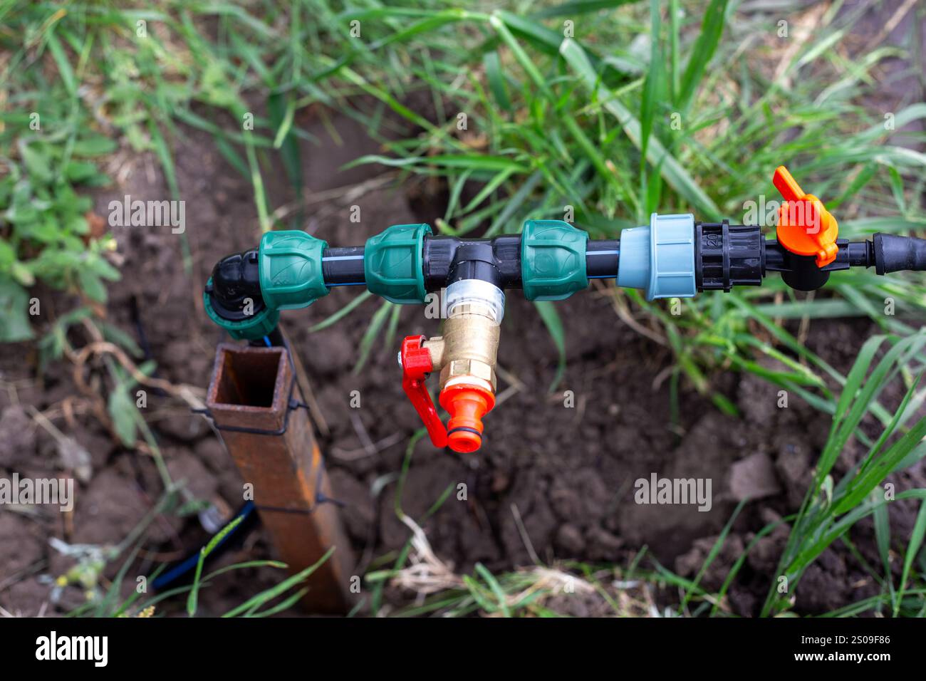 Installation of drip irrigation. Distribution unit of the irrigation ...