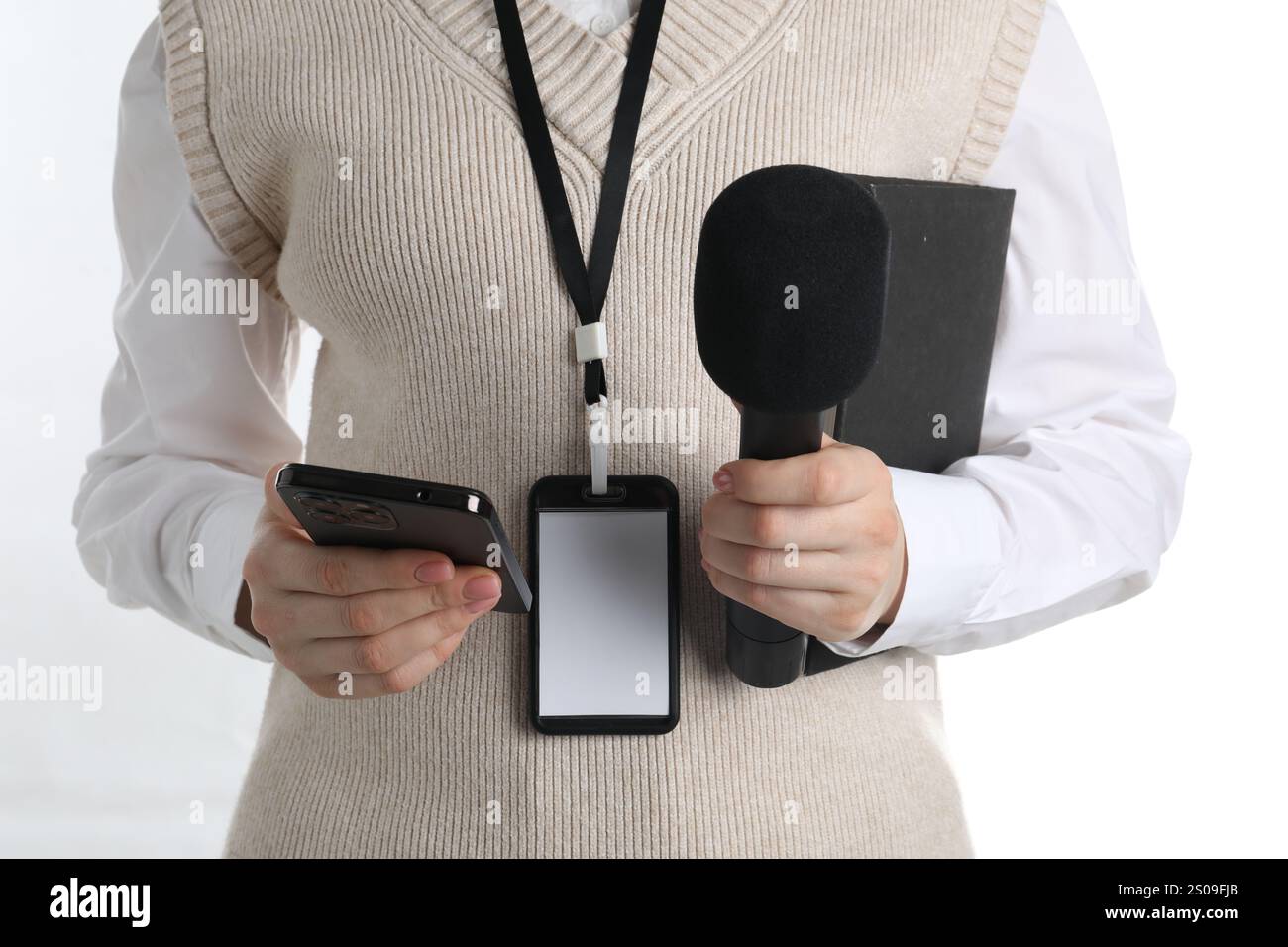 Journalist with microphones, smartphone and notebook on white ...