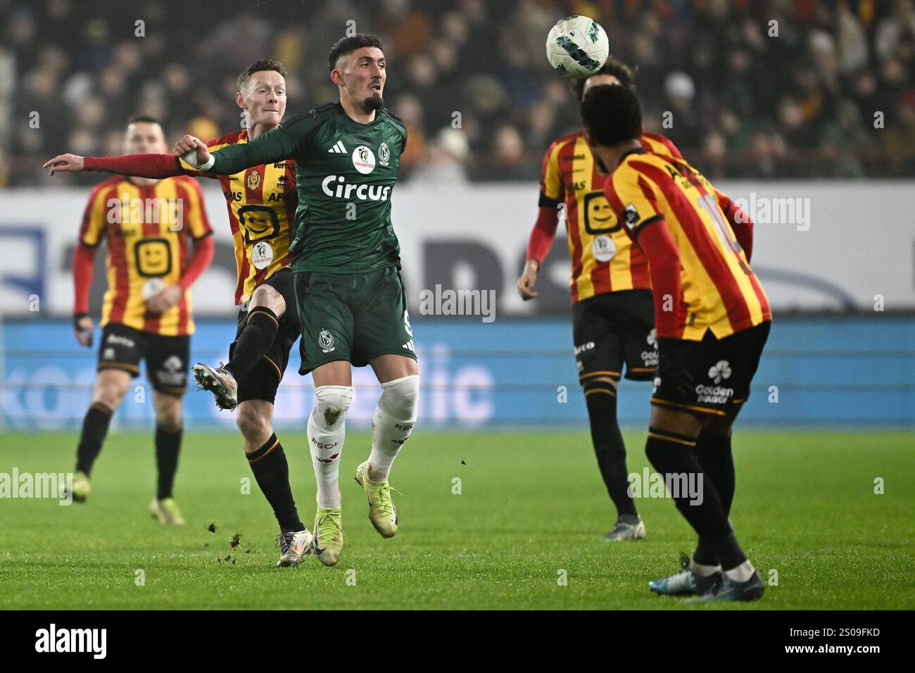 Mechelen, Belgium. 26th Dec, 2024. Mechelen's Rob Schoofs and Standard ...