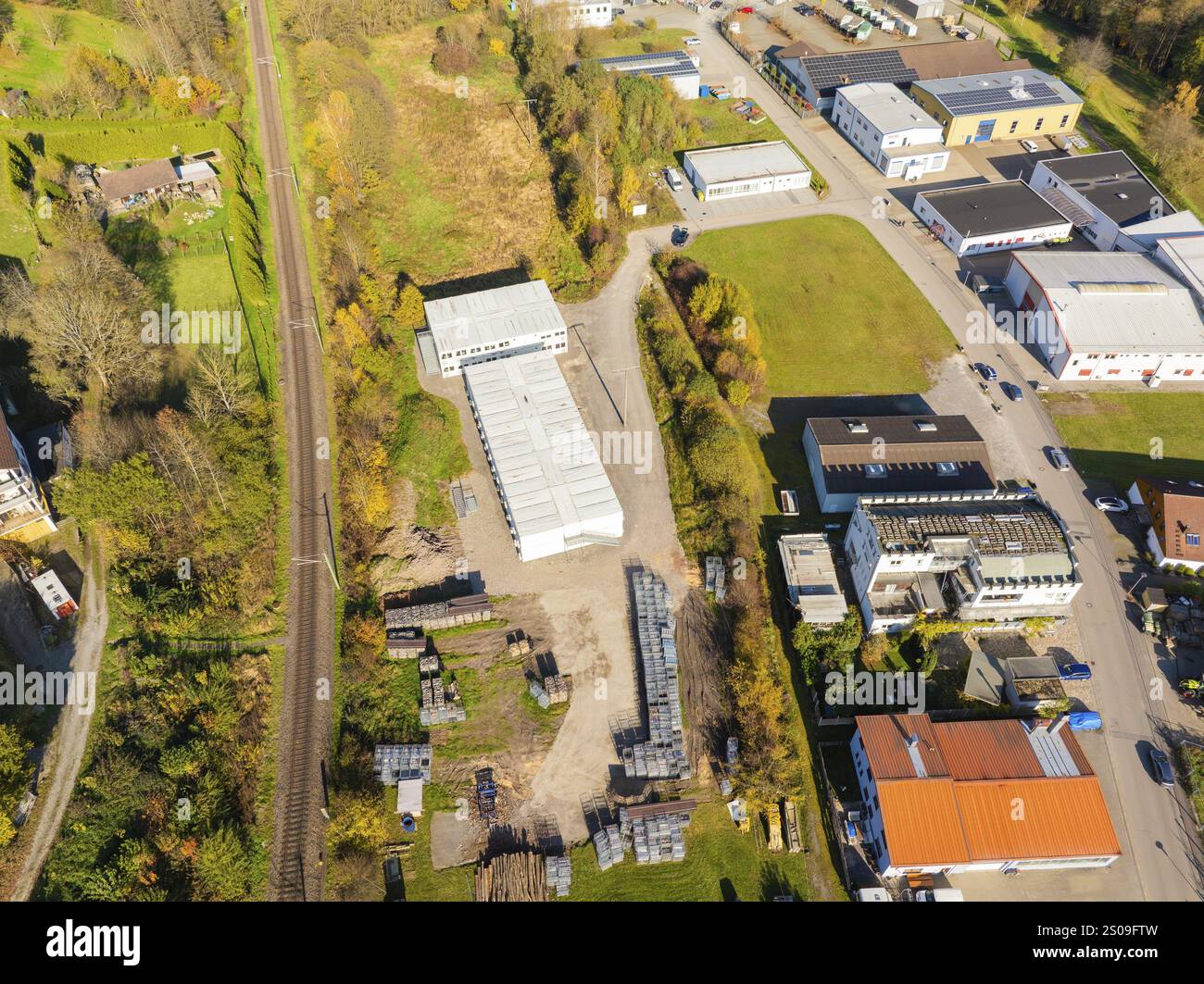 Aerial view of an industrial complex with surrounding buildings ...