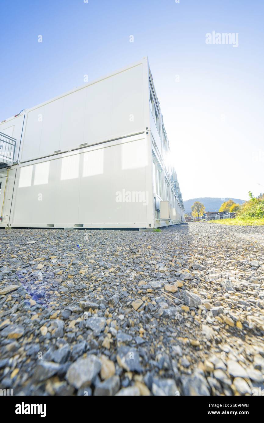 Modular container building on a gravel base under a clear sky in the ...