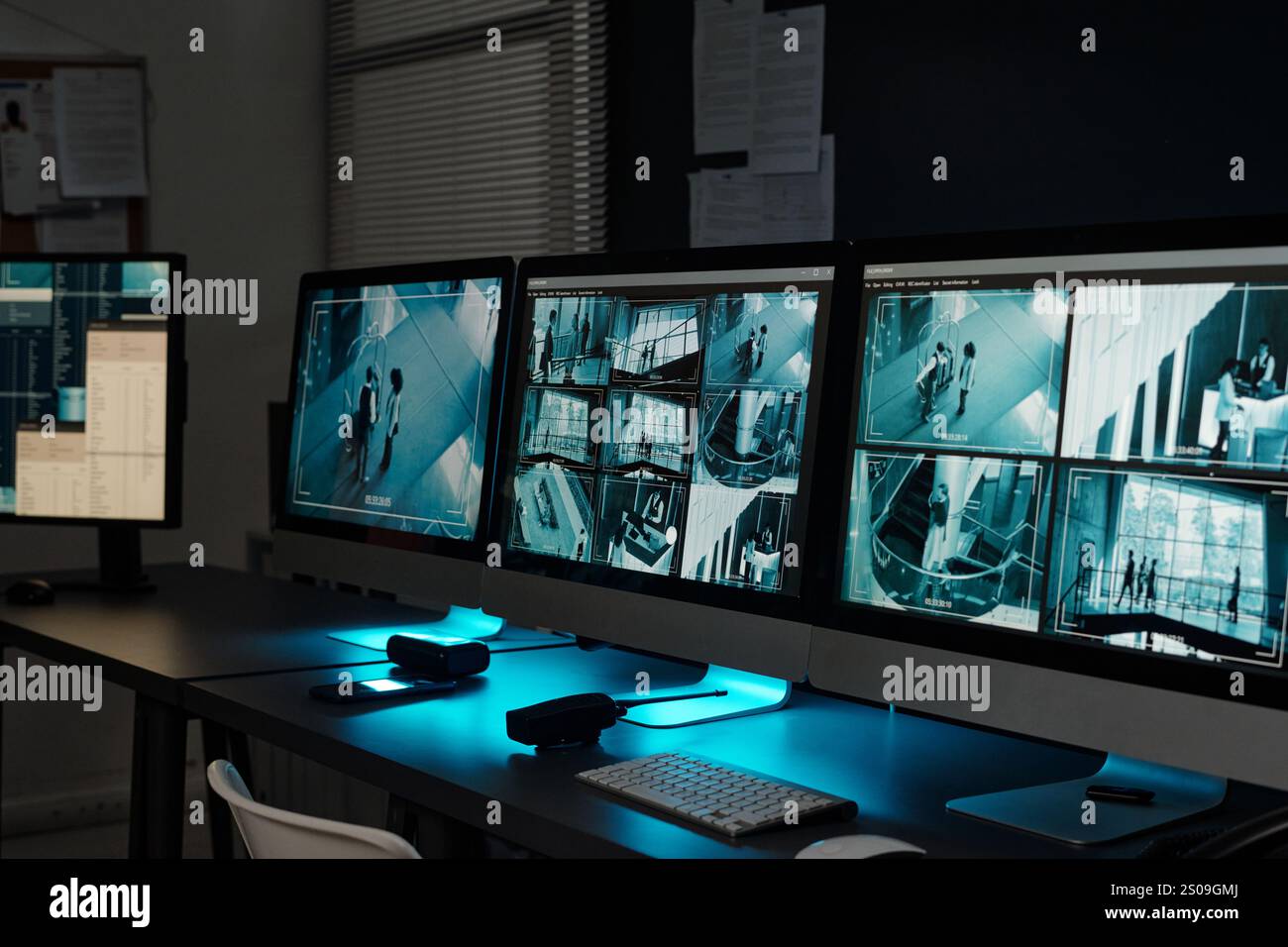 Workplace of absent officer of observation room with group of desktop ...