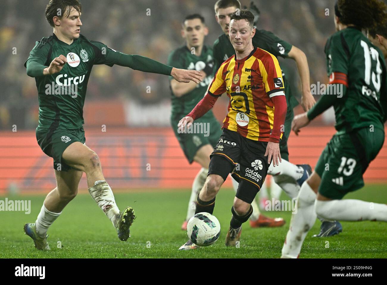 Mechelen, Belgium. 26th Dec, 2024. Mechelen's Rob Schoofs fights for ...