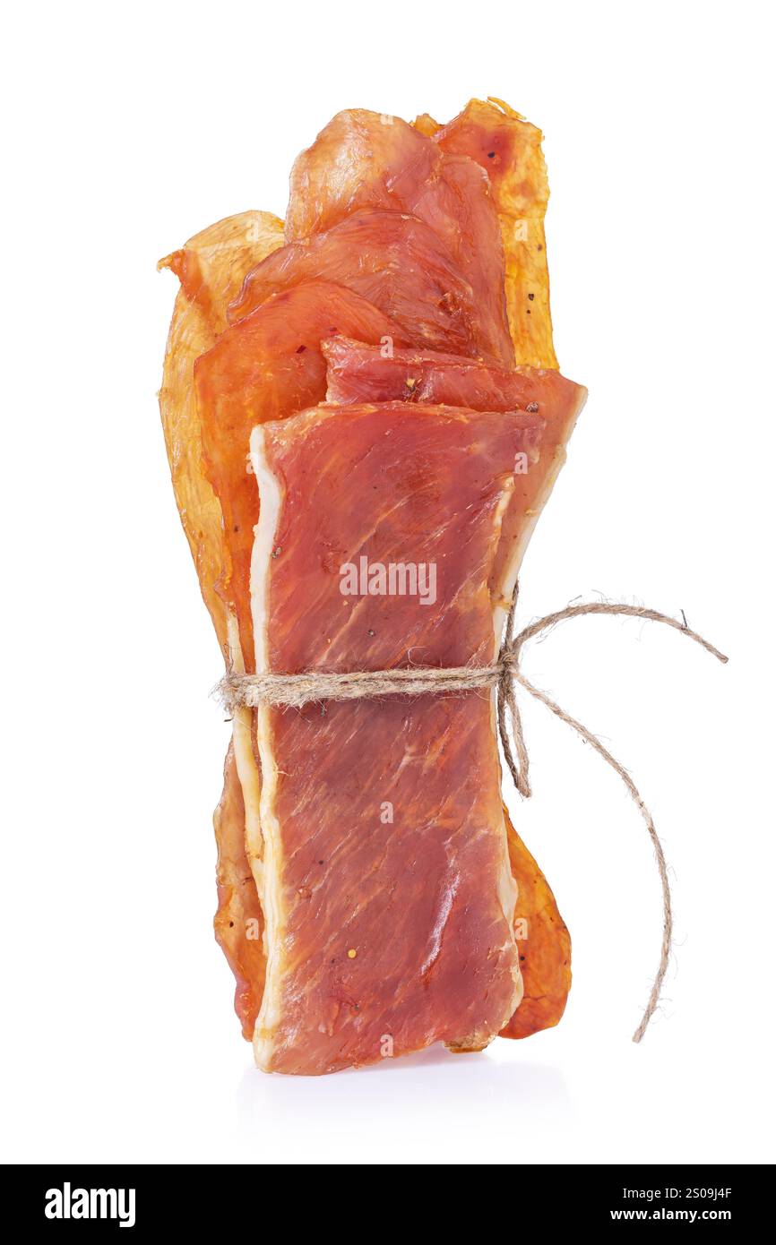 Uncooked smoked pork, chicken and turkey meat chips tied with rope ...