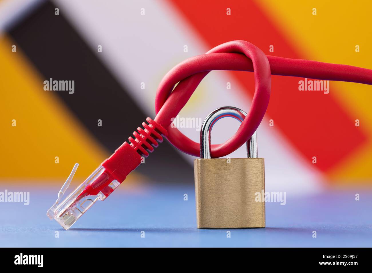 A closed lock on a tied network wire in a knot on the background of the ...