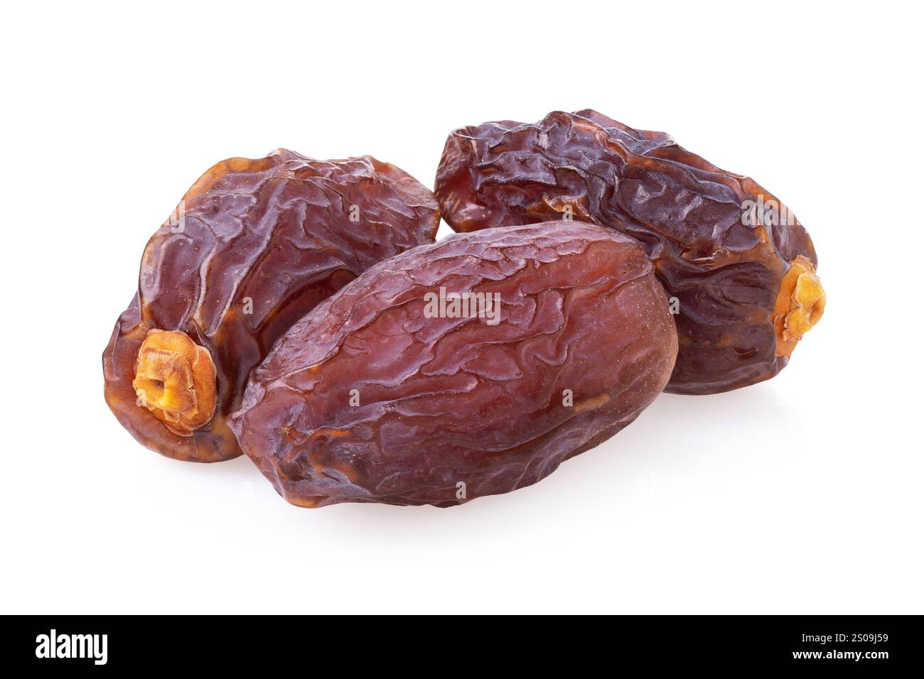 Three large dried dates isolated on white background Stock Photo - Alamy