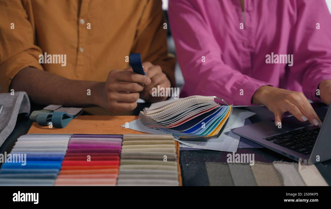 Male female hands touch choose color fabric samples collaborate fashion ...