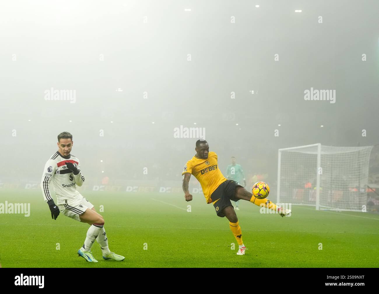 Wolverhampton Wanderers' Toti Gomes (right) clears the ball awa from ...
