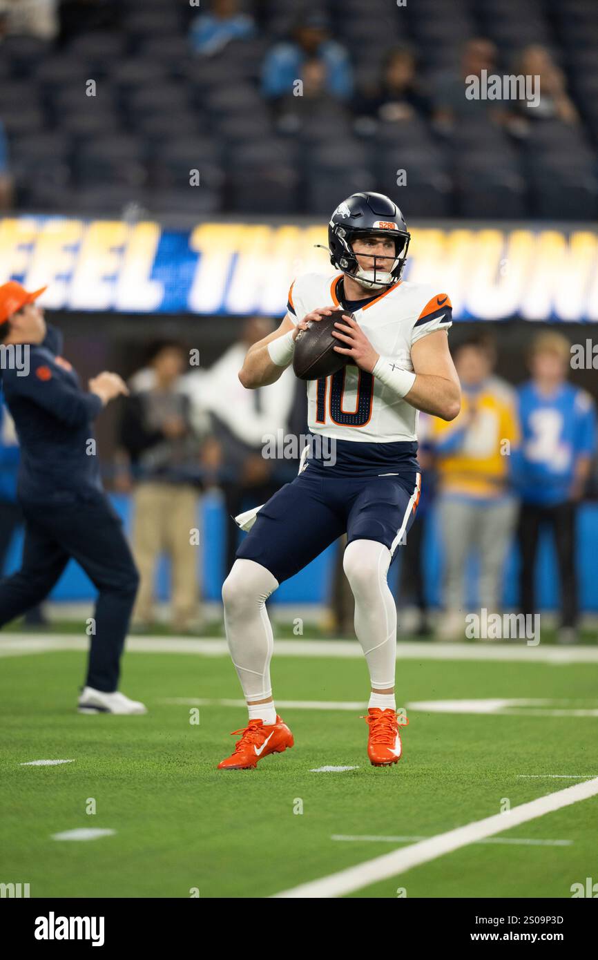 Denver Broncos quarterback Bo Nix (10) looks to throw a pass before an ...