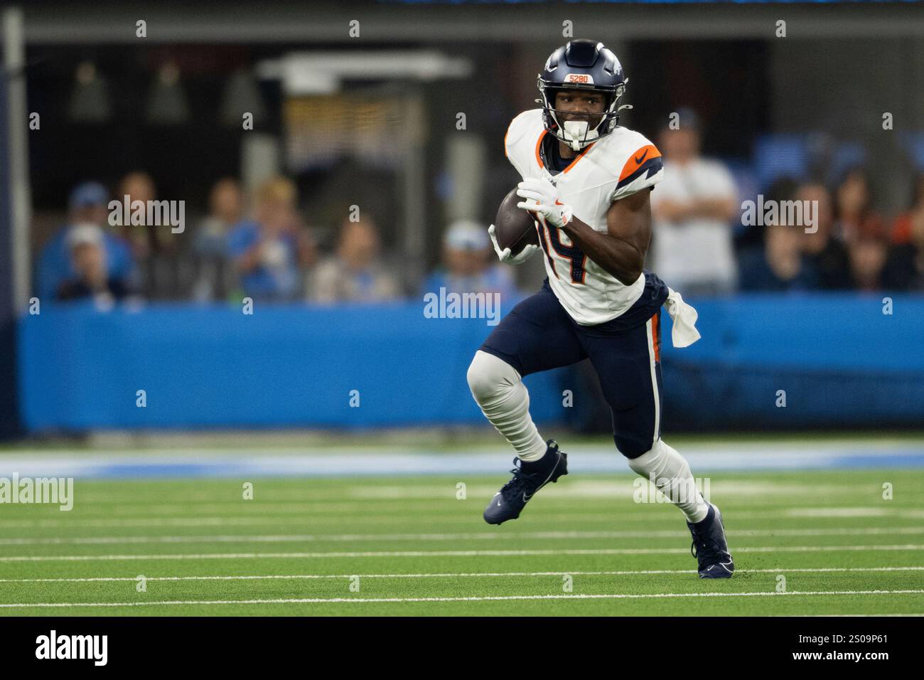 Denver Broncos wide receiver Marvin Mims Jr. (19) runs with the ball ...