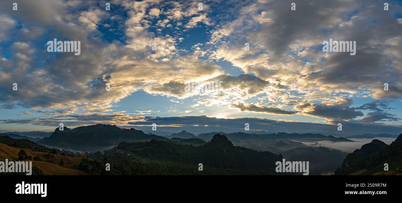 Aerial view A breathtaking view of dawn breaking over a misty mountain ...