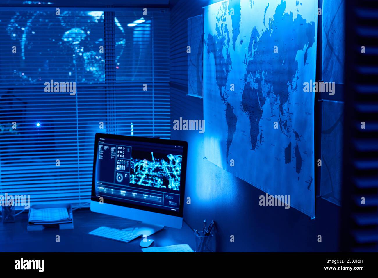 Map hanging on wall of military command center with computer monitor ...