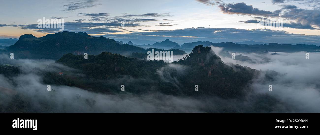 Aerial view A breathtaking view of dawn breaking over a misty mountain ...
