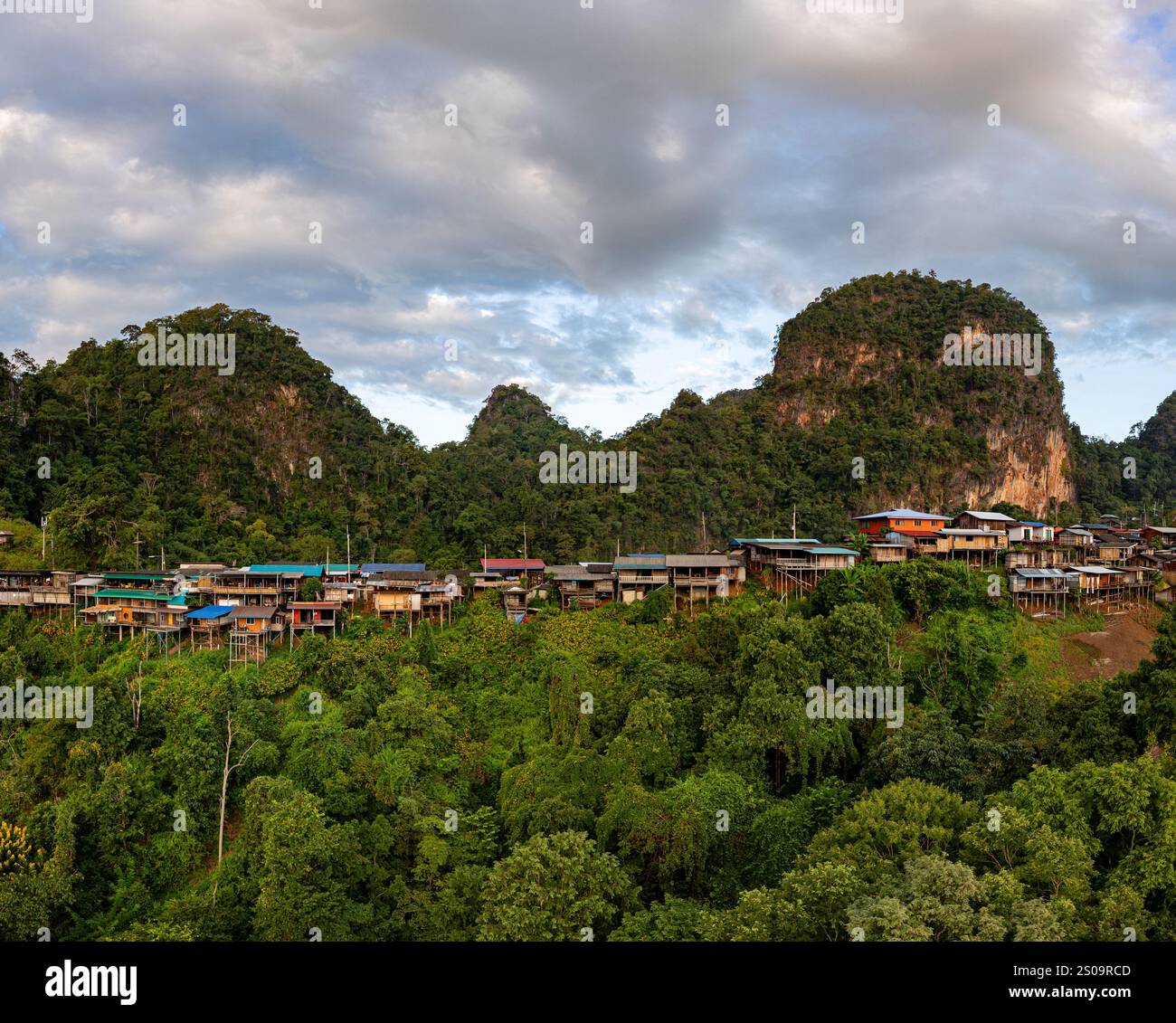 A breathtaking aerial view of a mountain village bathed in early ...