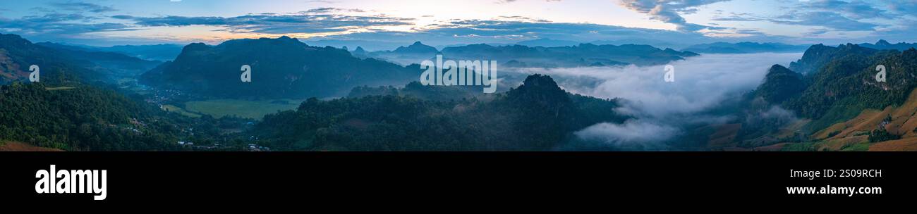 Aerial view A breathtaking view of dawn breaking over a misty mountain ...
