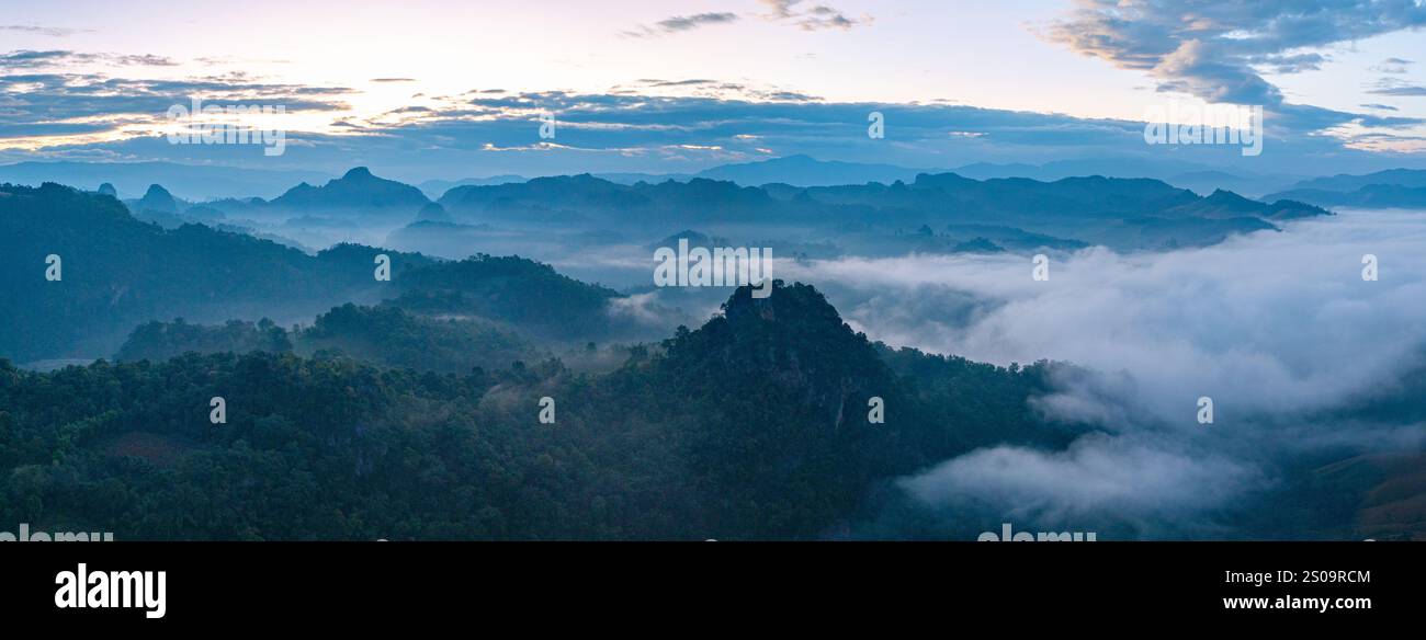 Aerial view A breathtaking view of dawn breaking over a misty mountain ...