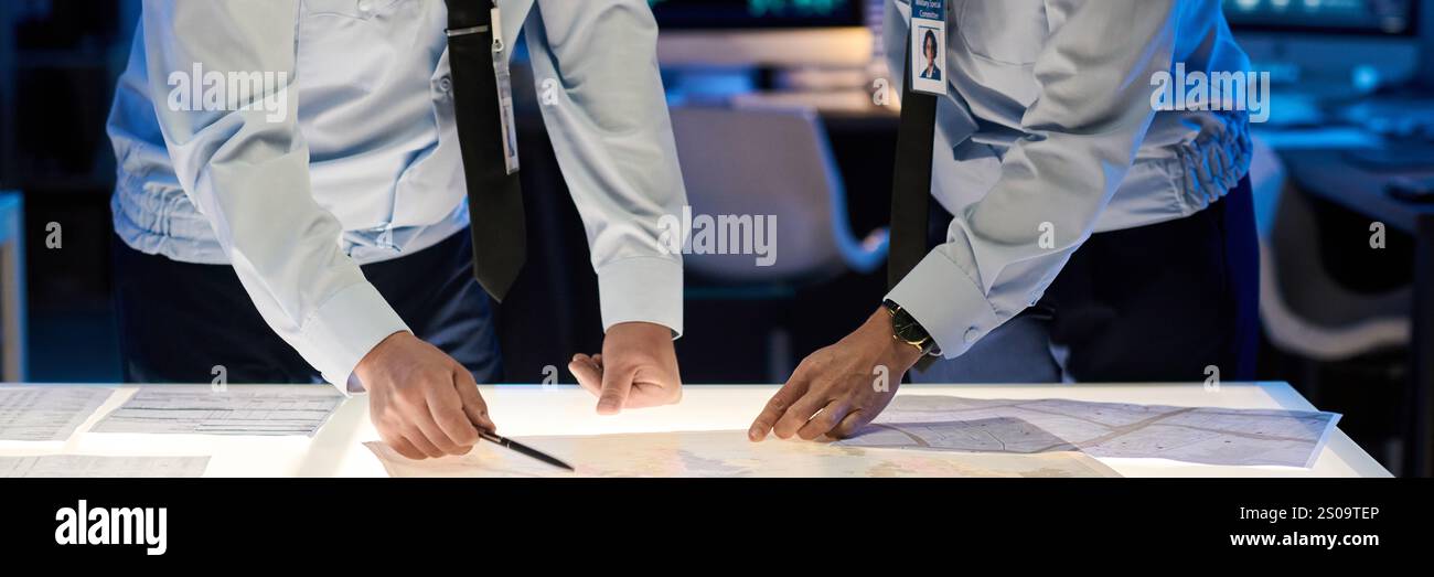 Header of male and female military officers bending over table with ...