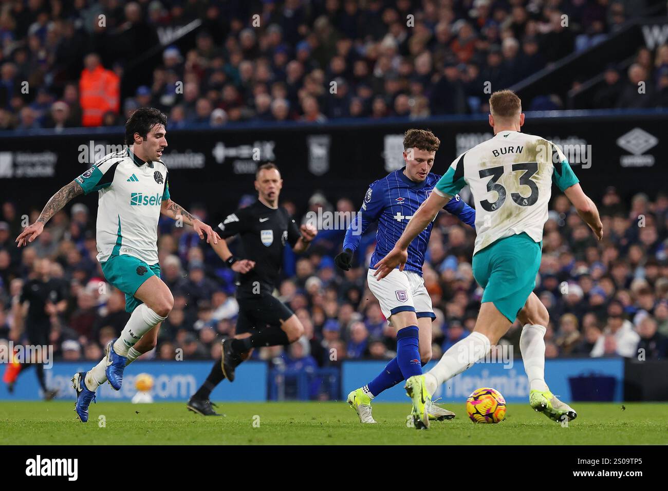 Nathan Broadhead of Ipswich Town in action with Dan Burn and Sandro ...