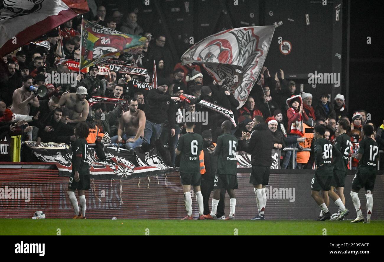 Mechelen, Belgium. 26th Dec, 2024. Standard's supporters and after a ...