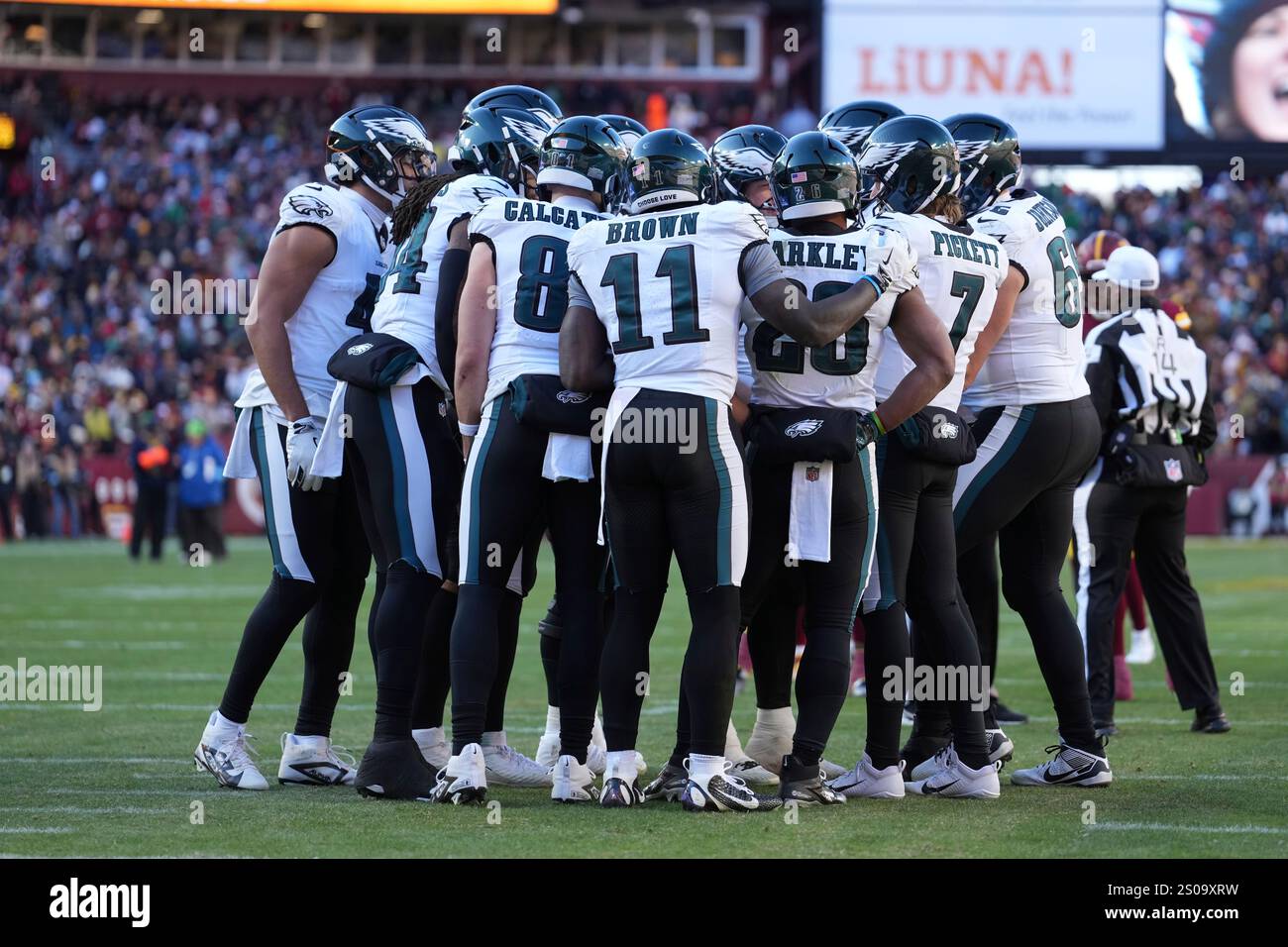 The Philadelphia Eagles offense huddles for a play during an NFL ...