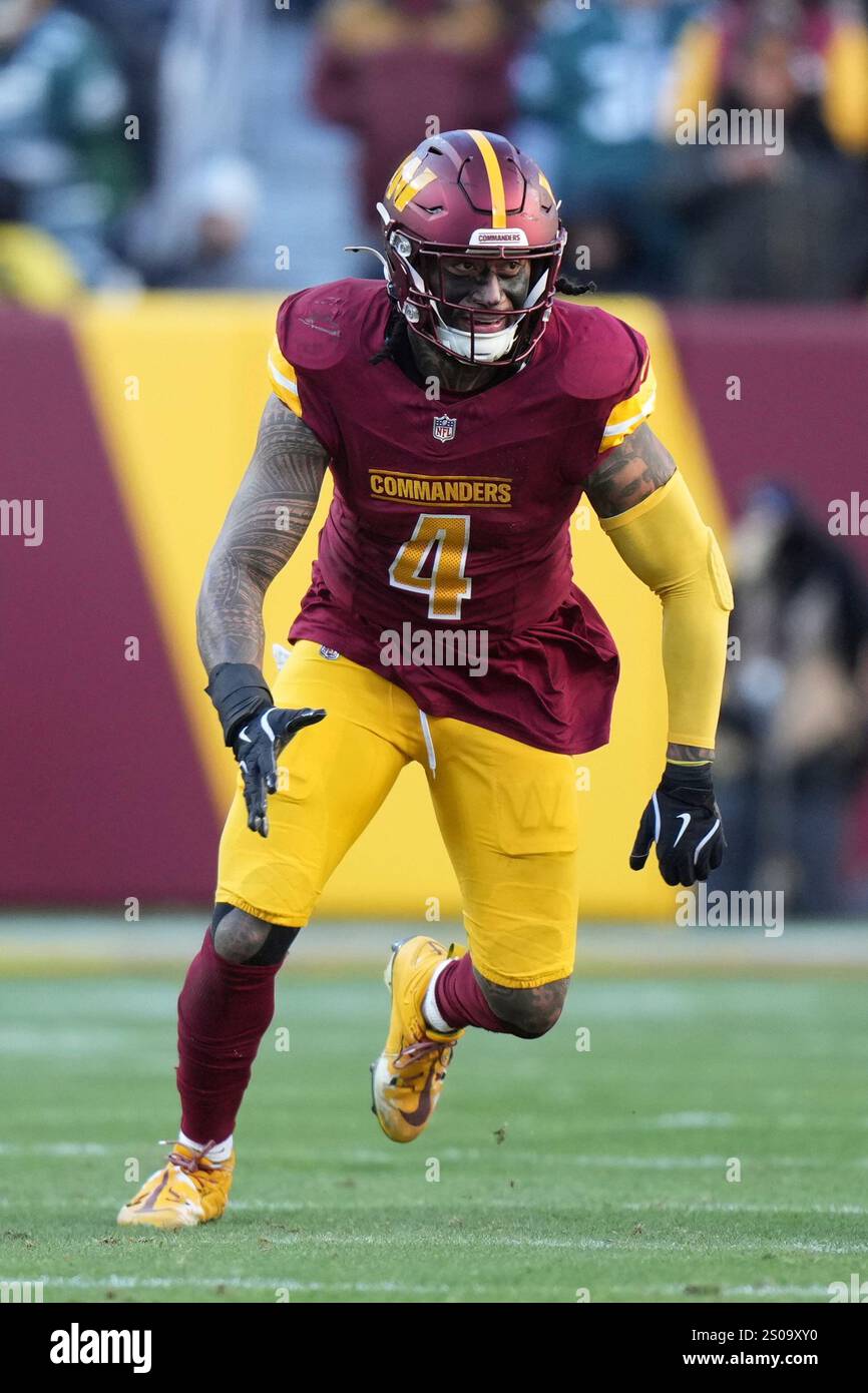 Washington Commanders linebacker Frankie Luvu (4) rushes the passer ...