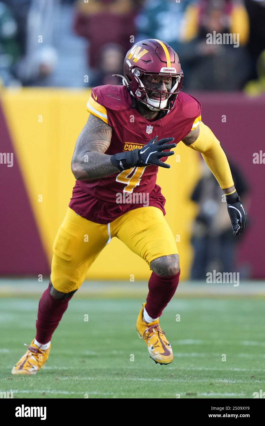 Washington Commanders linebacker Frankie Luvu (4) rushes the passer ...