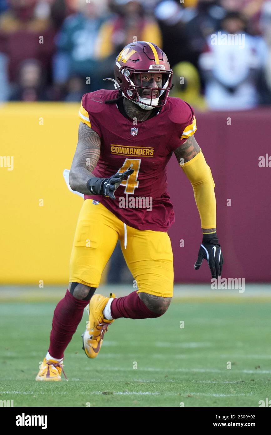 Washington Commanders linebacker Frankie Luvu (4) rushes the passer ...