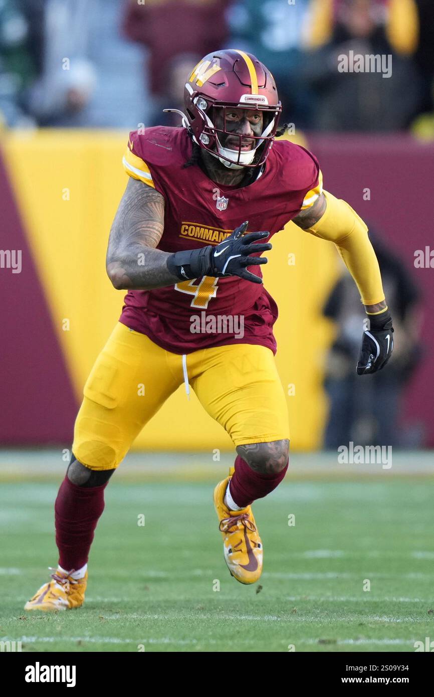 Washington Commanders linebacker Frankie Luvu (4) rushes the passer ...