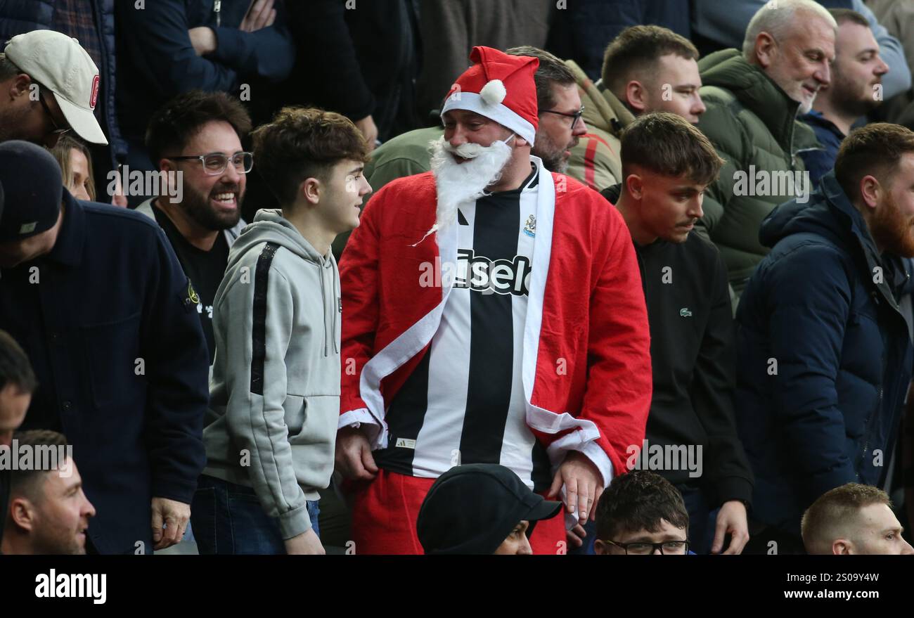 A Newcastle United fan dressed as Santa Clause during the Premier ...