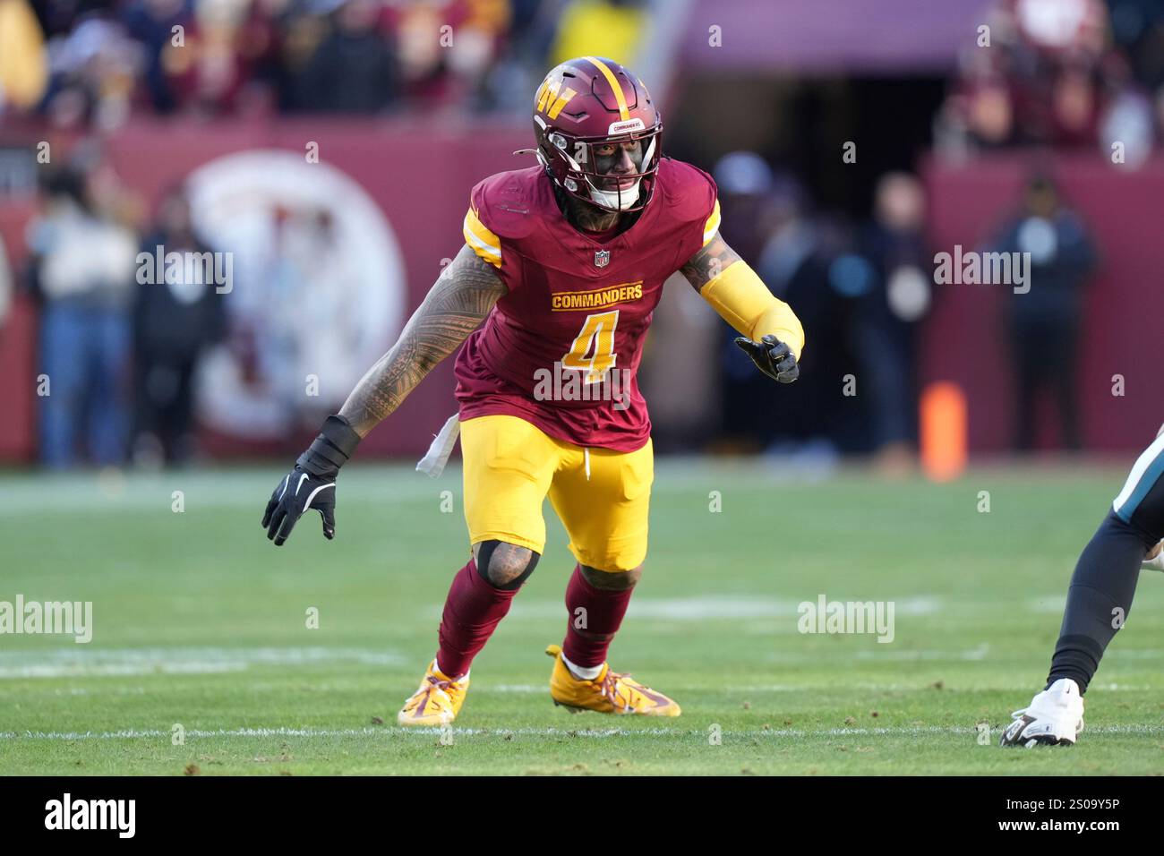 Washington Commanders linebacker Frankie Luvu (4) rushes the passer ...