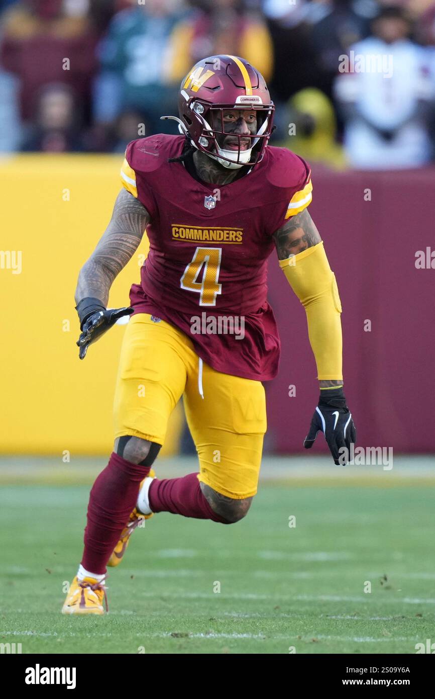 Washington Commanders linebacker Frankie Luvu (4) rushes the passer ...