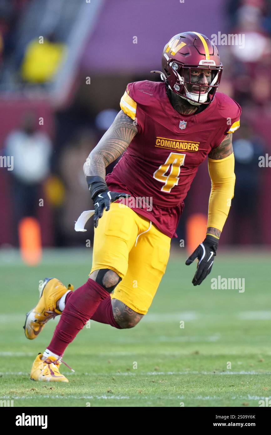 Washington Commanders linebacker Frankie Luvu (4) rushes the passer ...