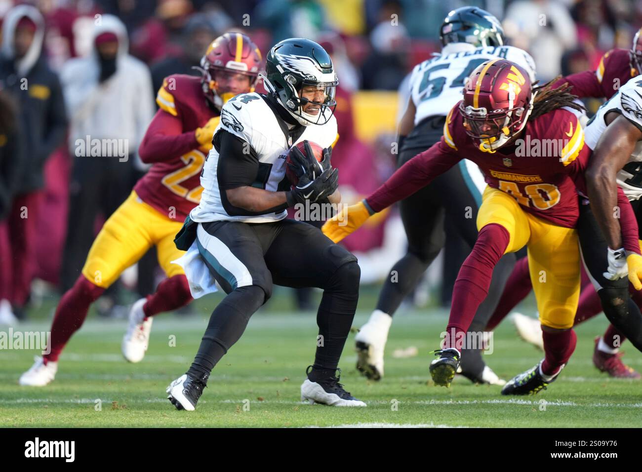 Philadelphia Eagles running back Kenneth Gainwell (14) braces for a hit ...