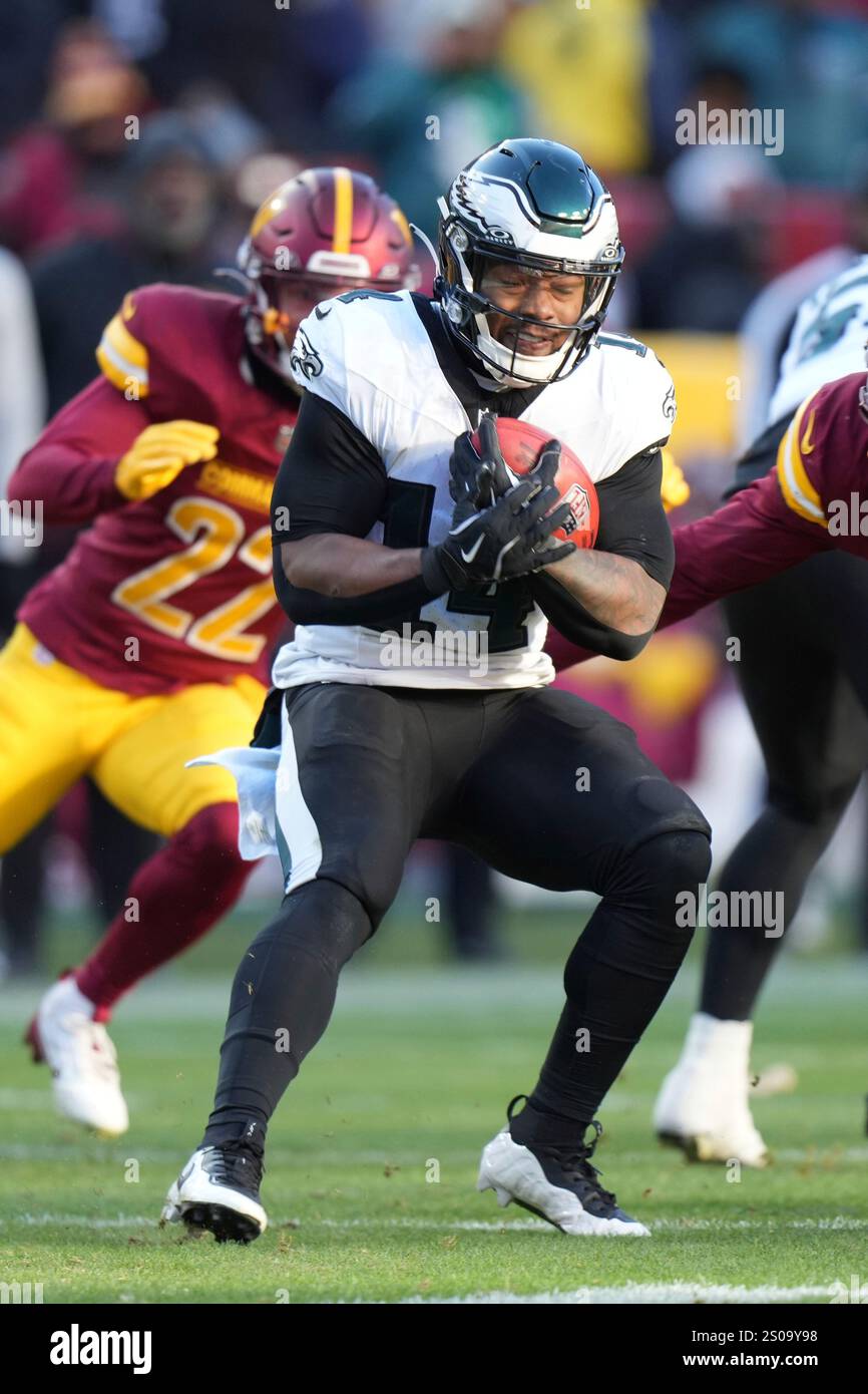 Philadelphia Eagles running back Kenneth Gainwell (14) braces for a hit ...