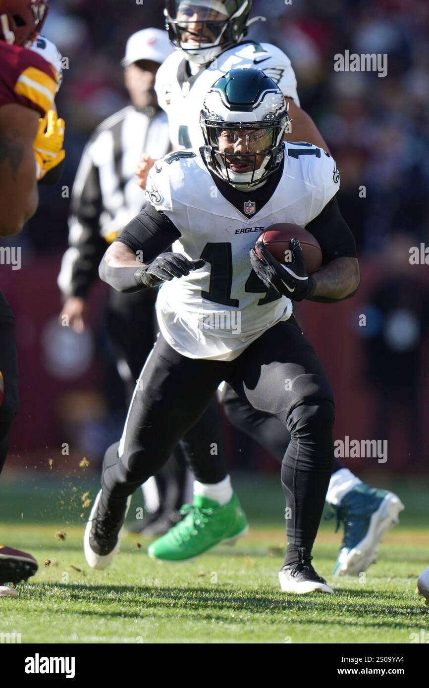 Philadelphia Eagles running back Kenneth Gainwell (14) rushes with he ...