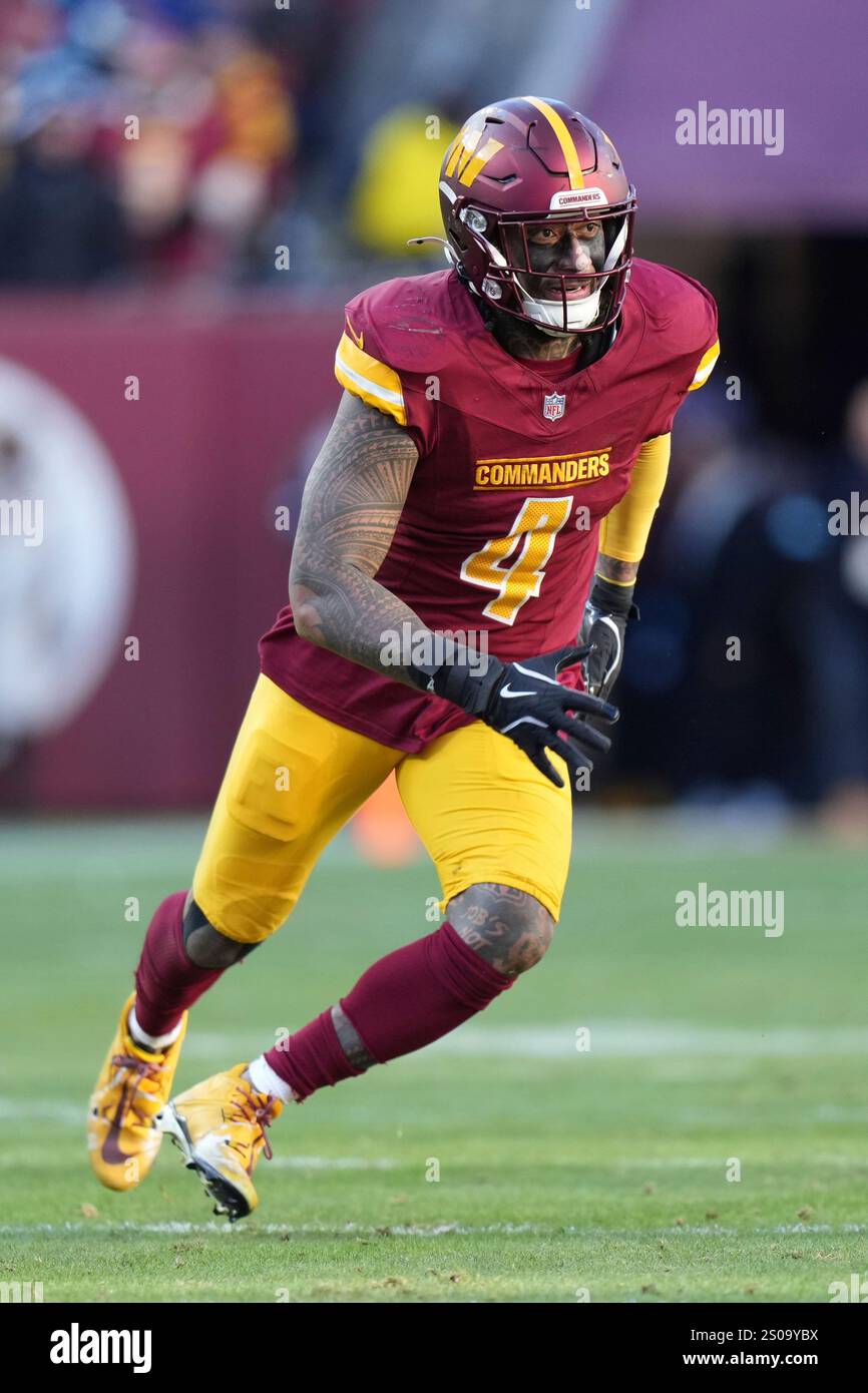 Washington Commanders linebacker Frankie Luvu (4) rushes the passer ...