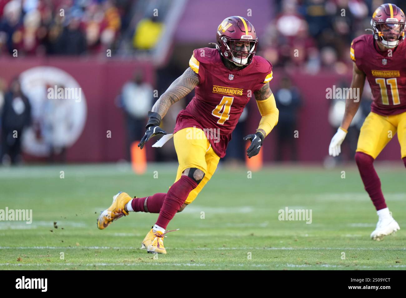 Washington Commanders linebacker Frankie Luvu (4) rushes the passer ...