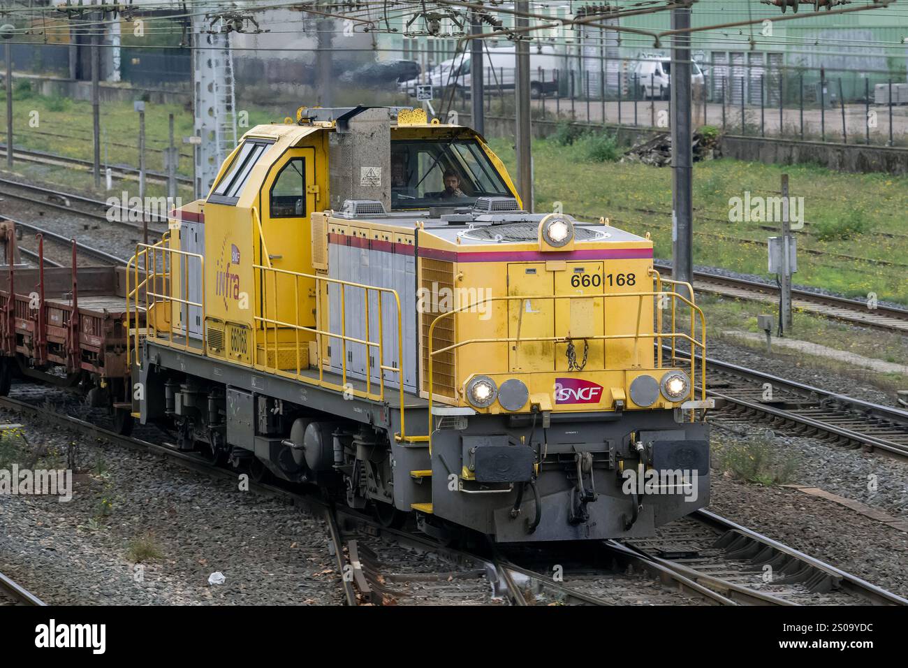 Nancy, France - View on a grey and yellow heavy shunter BB 60000 crossing the Nancy station ...