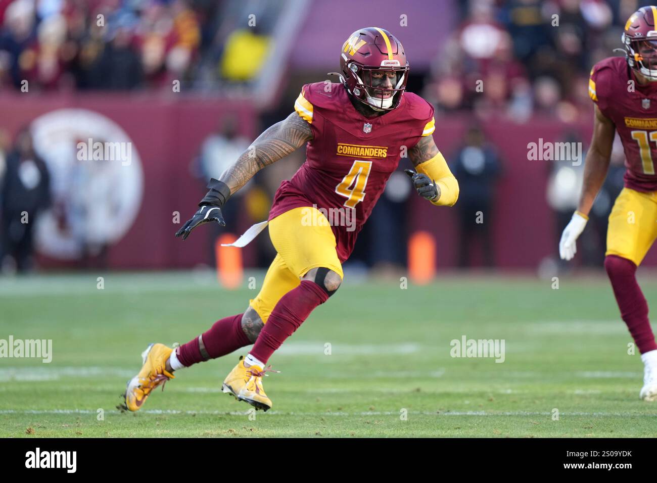 Washington Commanders linebacker Frankie Luvu (4) rushes the passer ...