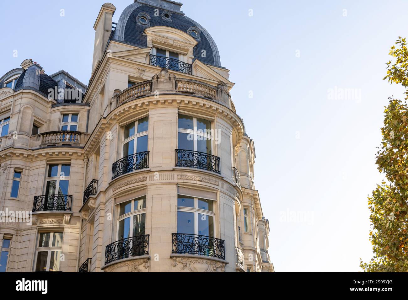 This stunning view highlights a classic Parisian building with ornate ...