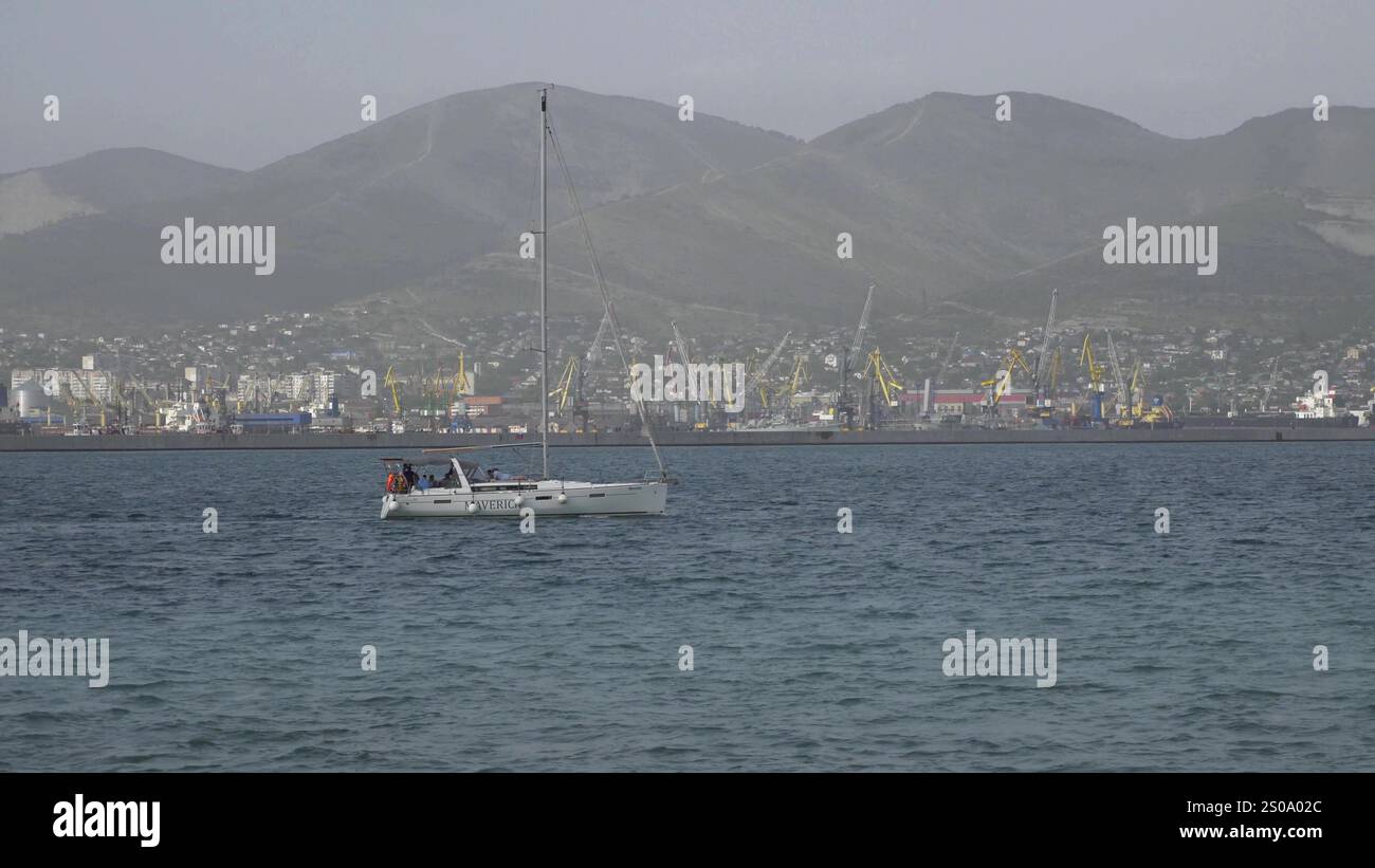 Novorossiysk, Russia - 18 August 2023. red port ship name Maverick in ...